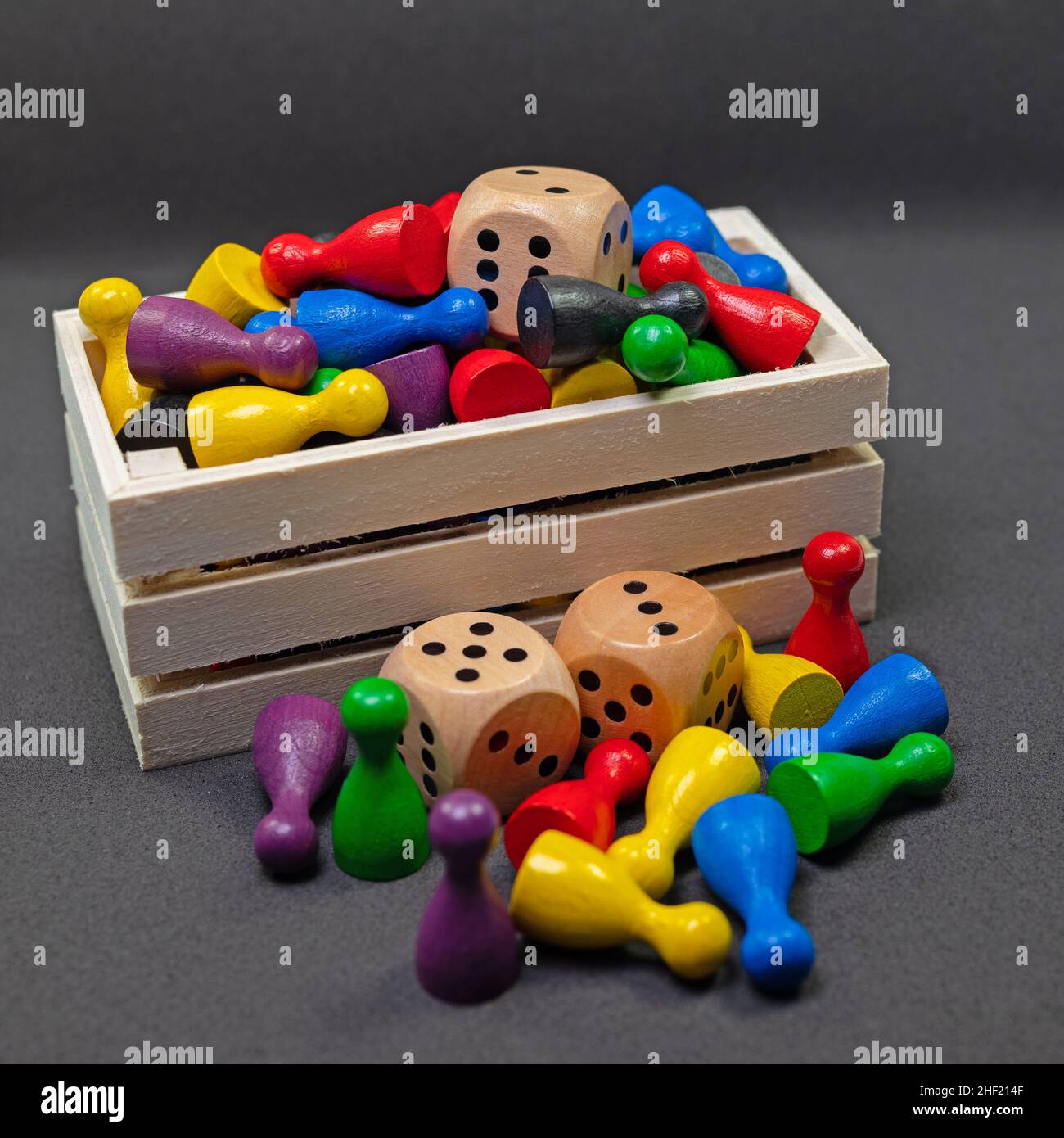 Lots of colorful game pieces and dice for board games Stock Photo - Alamy