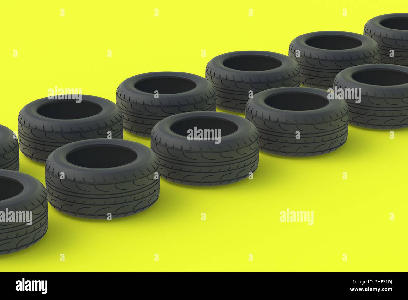 Row of car rubber tyres on yellow background. Automotive parts. Traffic ...
