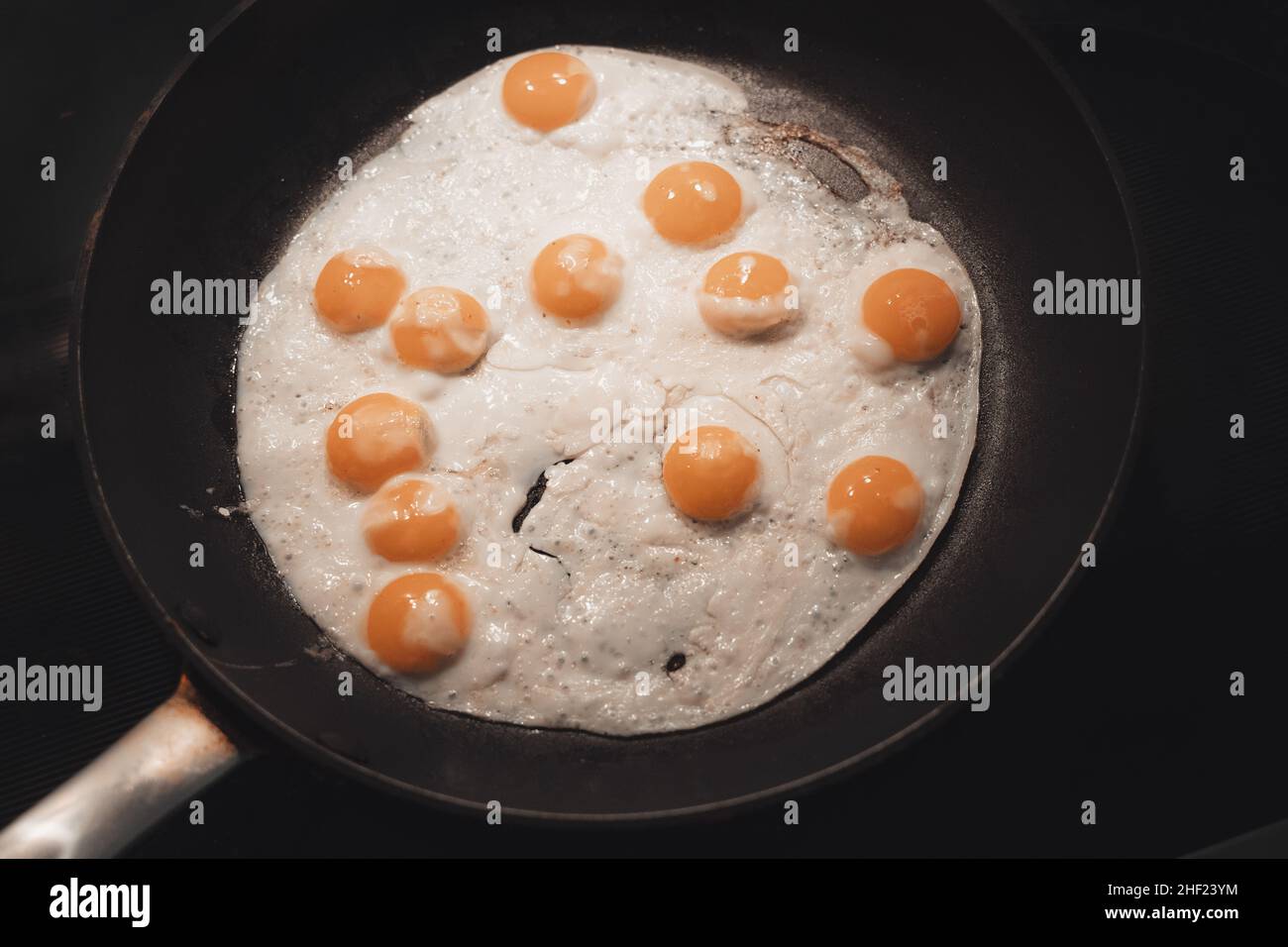 Common quail eggs cooking for breakfast Stock Photo - Alamy