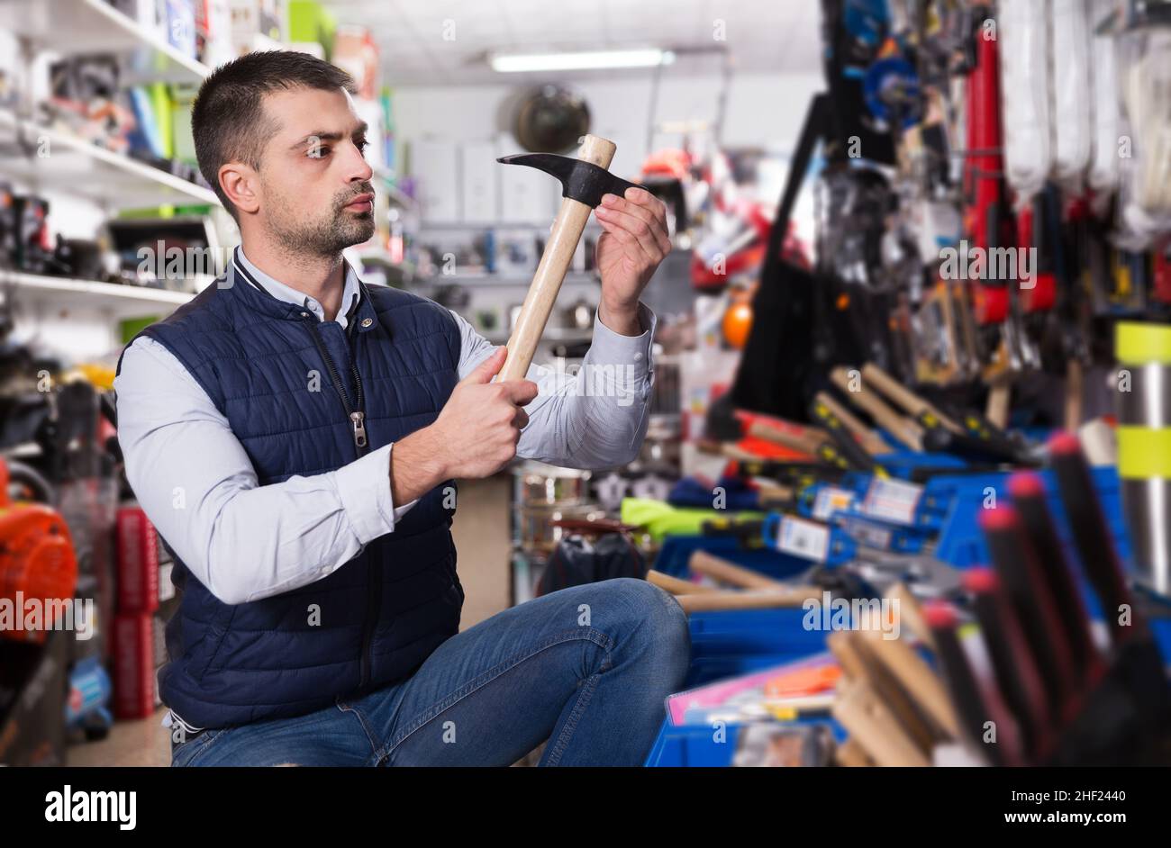 male is standing with new hammer Stock Photo - Alamy