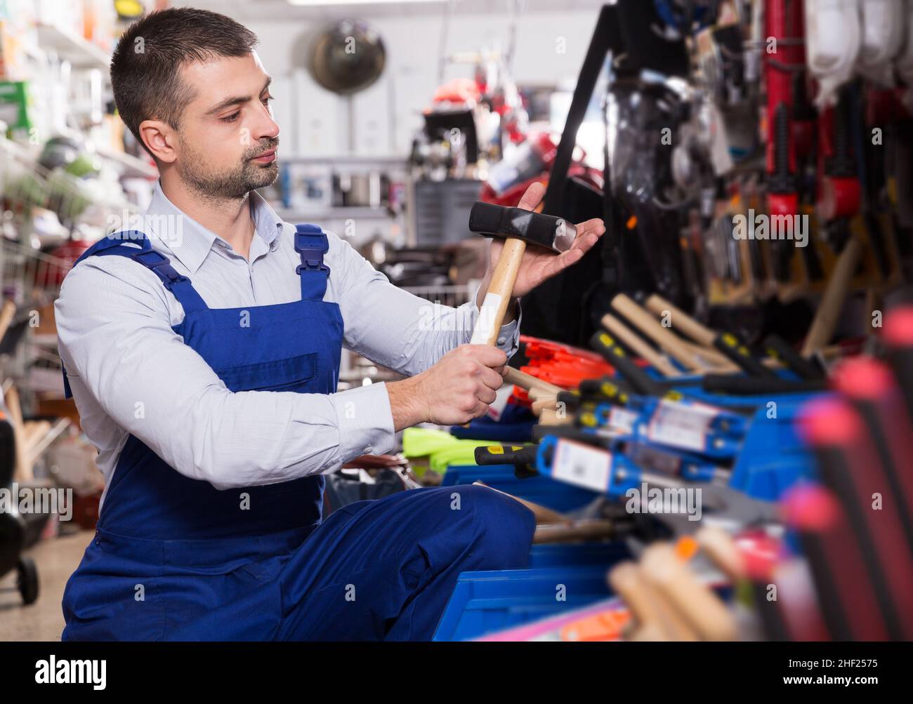 male is standing with new hammer Stock Photo - Alamy