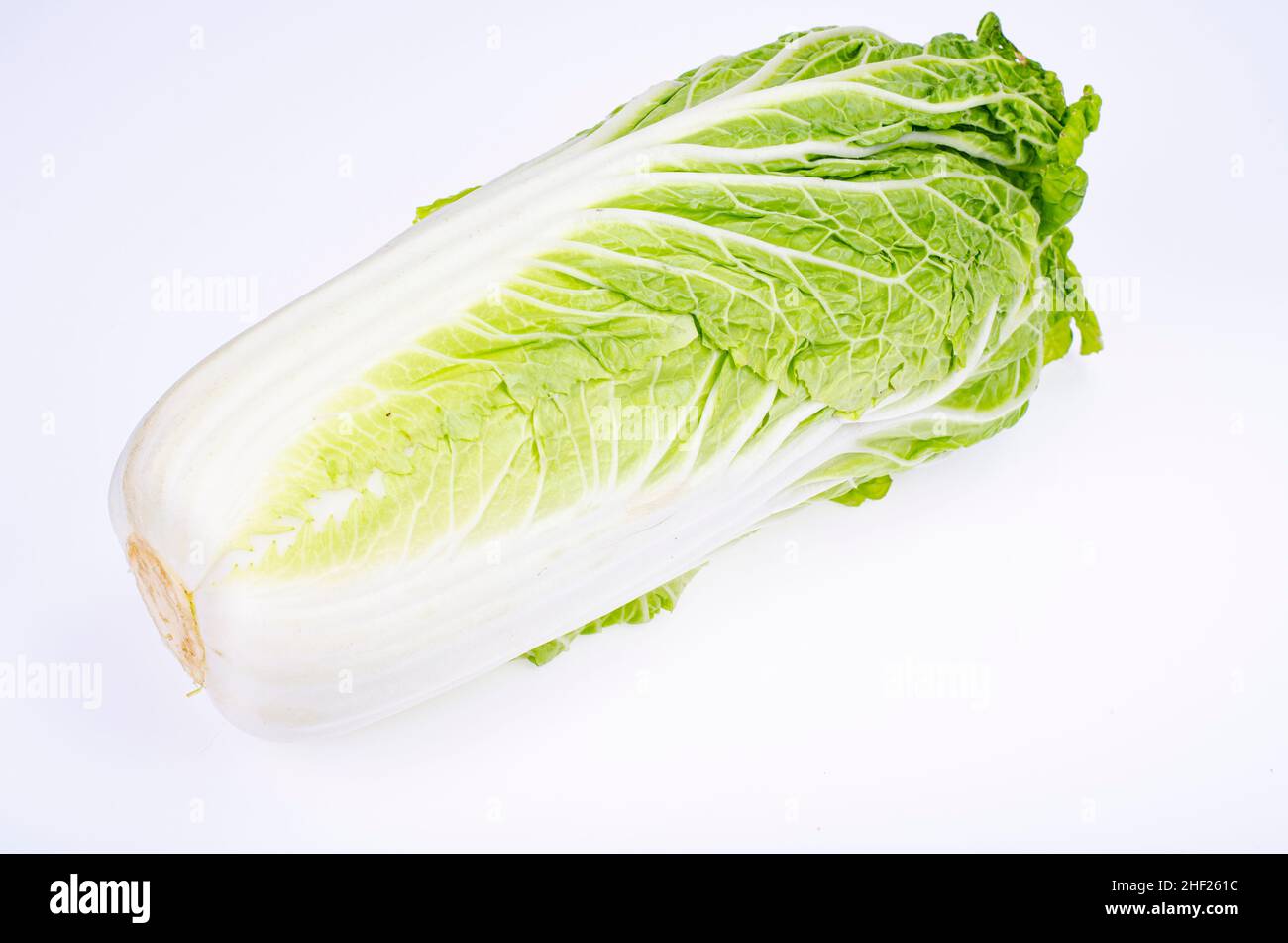 Whole head of green Beijing cabbage isolated on white background. Photo ...