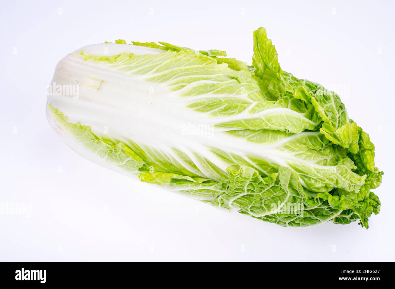 Whole head of green Beijing cabbage isolated on white background. Photo ...
