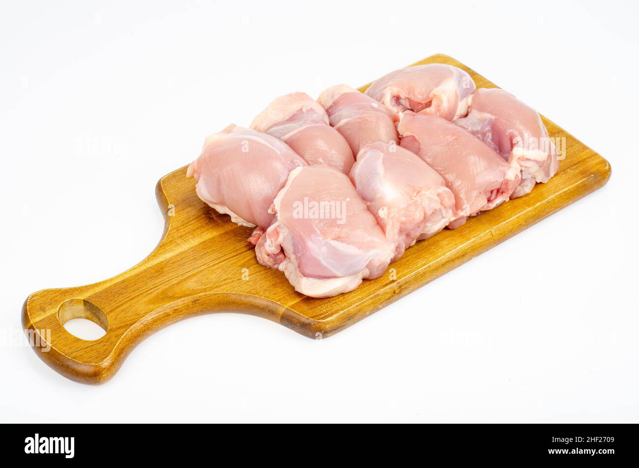 Pieces of chicken thigh meat without skin and bone. Photo Stock Photo ...