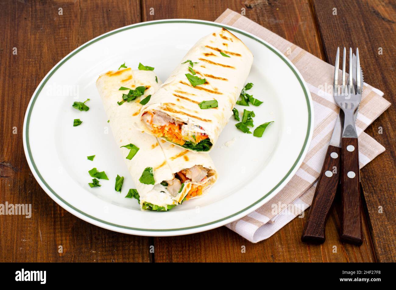 Thin lavash with vegetables and chicken on plate, shawarma. Photo Stock ...