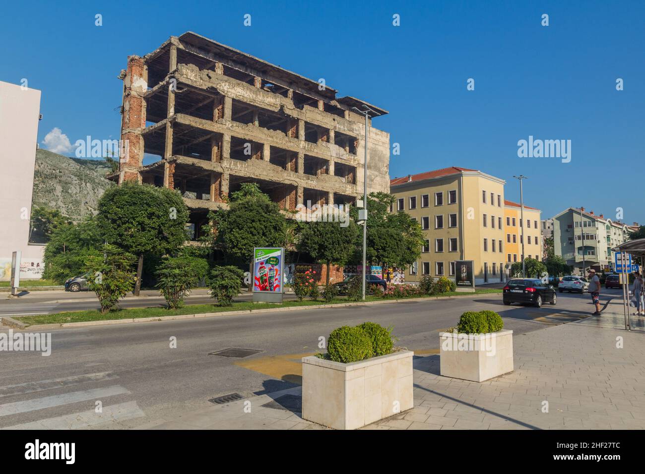 MOSTAR, BOSNIA AND HERZEGOVINA - JUNE 10, 2019: War damaged buildings ...
