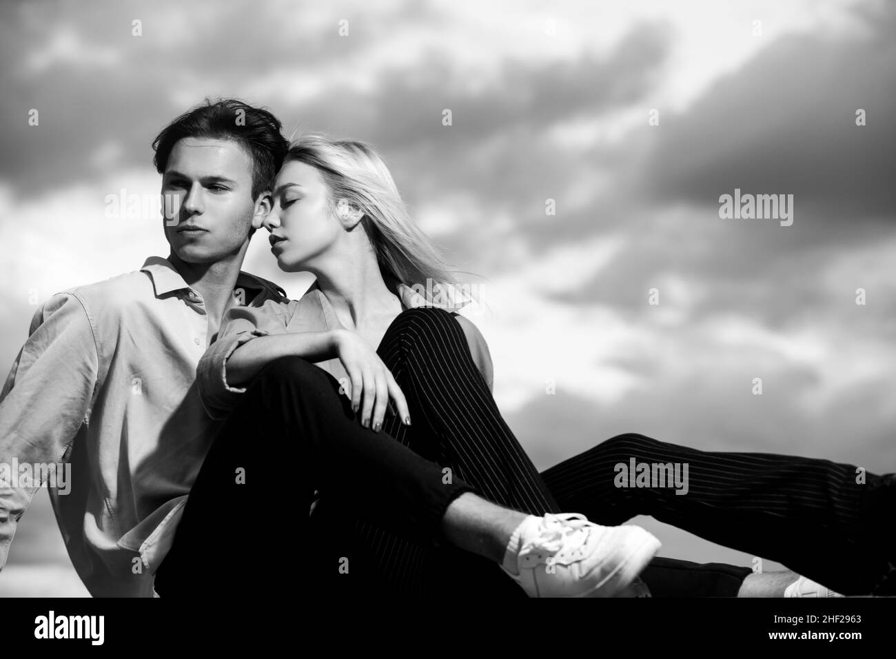 Young lovers hugging and embracing. Couple in love tenderness and ...