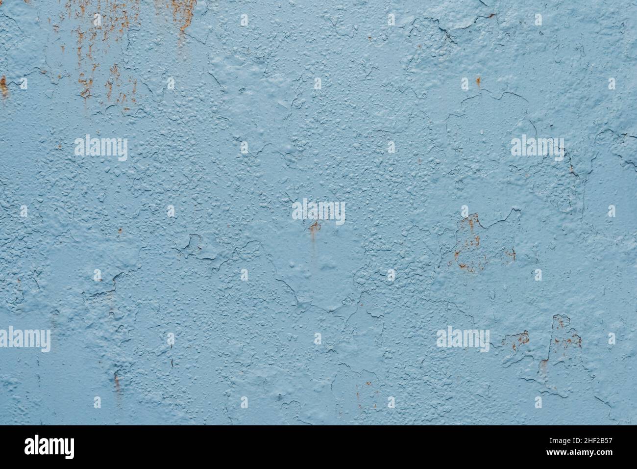 Blue peeling paint with old, worn-out metallic weathered iron texture ...