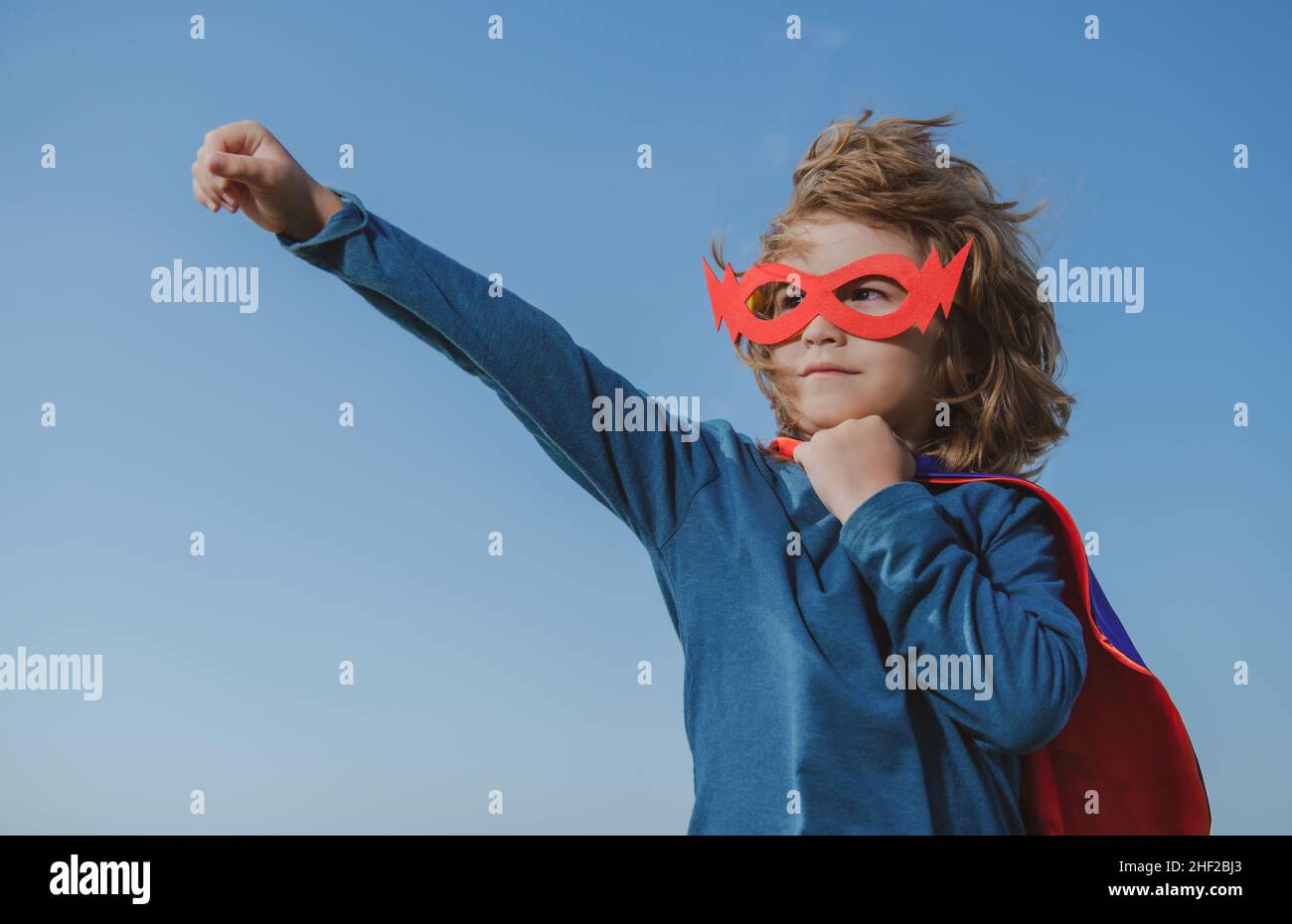 Little child is playing superhero. Boy super hero concept Stock Photo ...