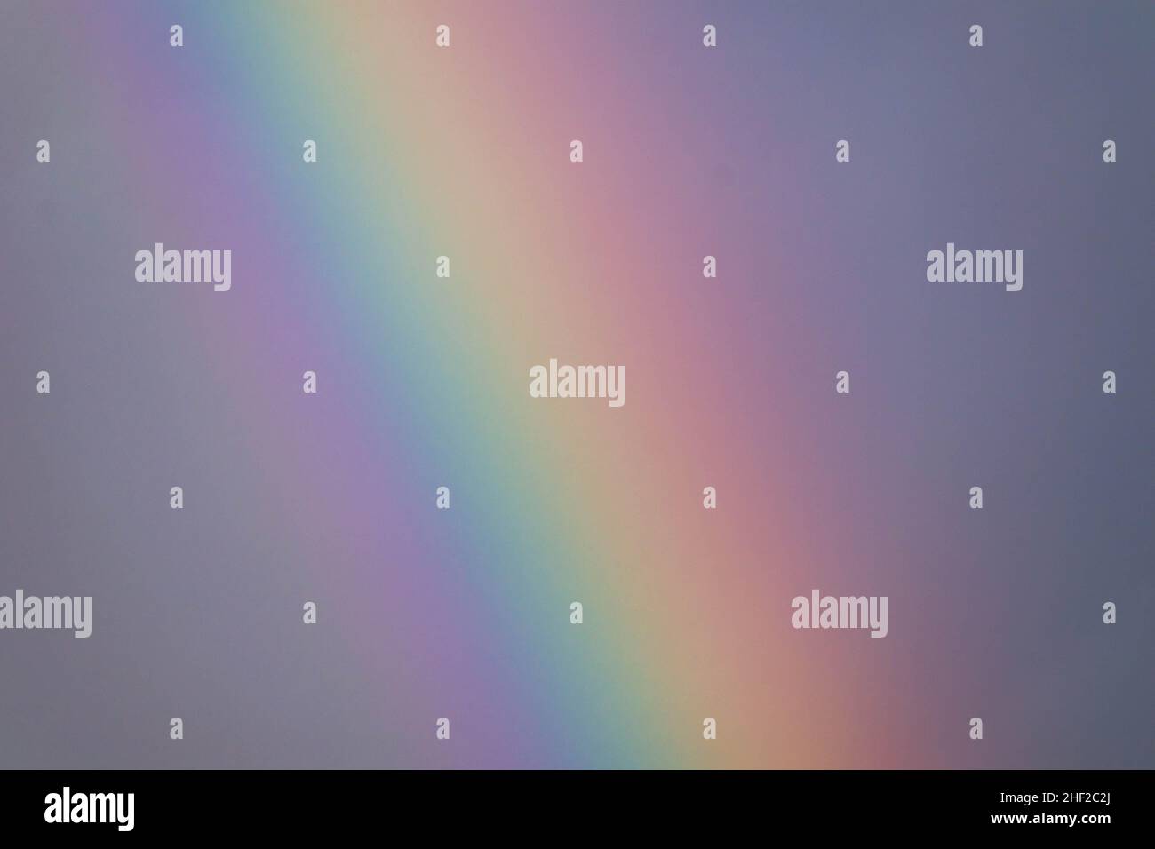 a close up image of a vertical rainbow after a thunderstorm over the ...