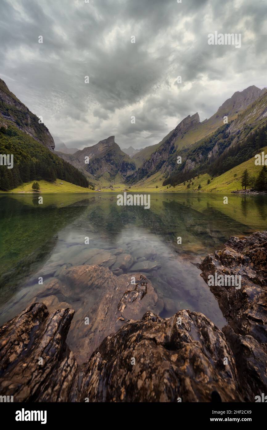 Seealpsee in the Swiss Alps during a rainy day, post processed using ...