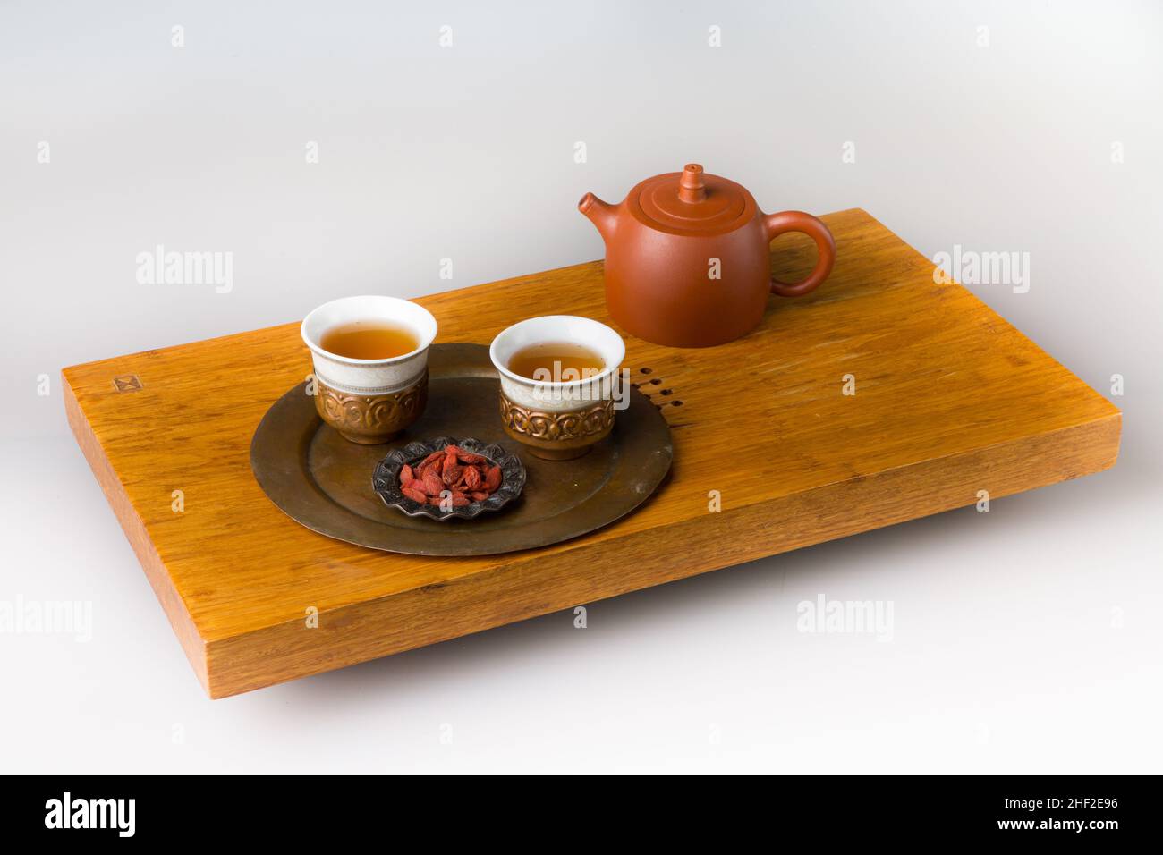 Ceramic teapot and three traditional cups for oriental tea drinking on ...