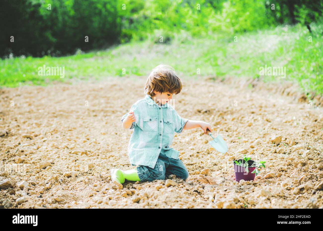 Become little farmer. Happy child gardener. Spring season. Young farmer ...