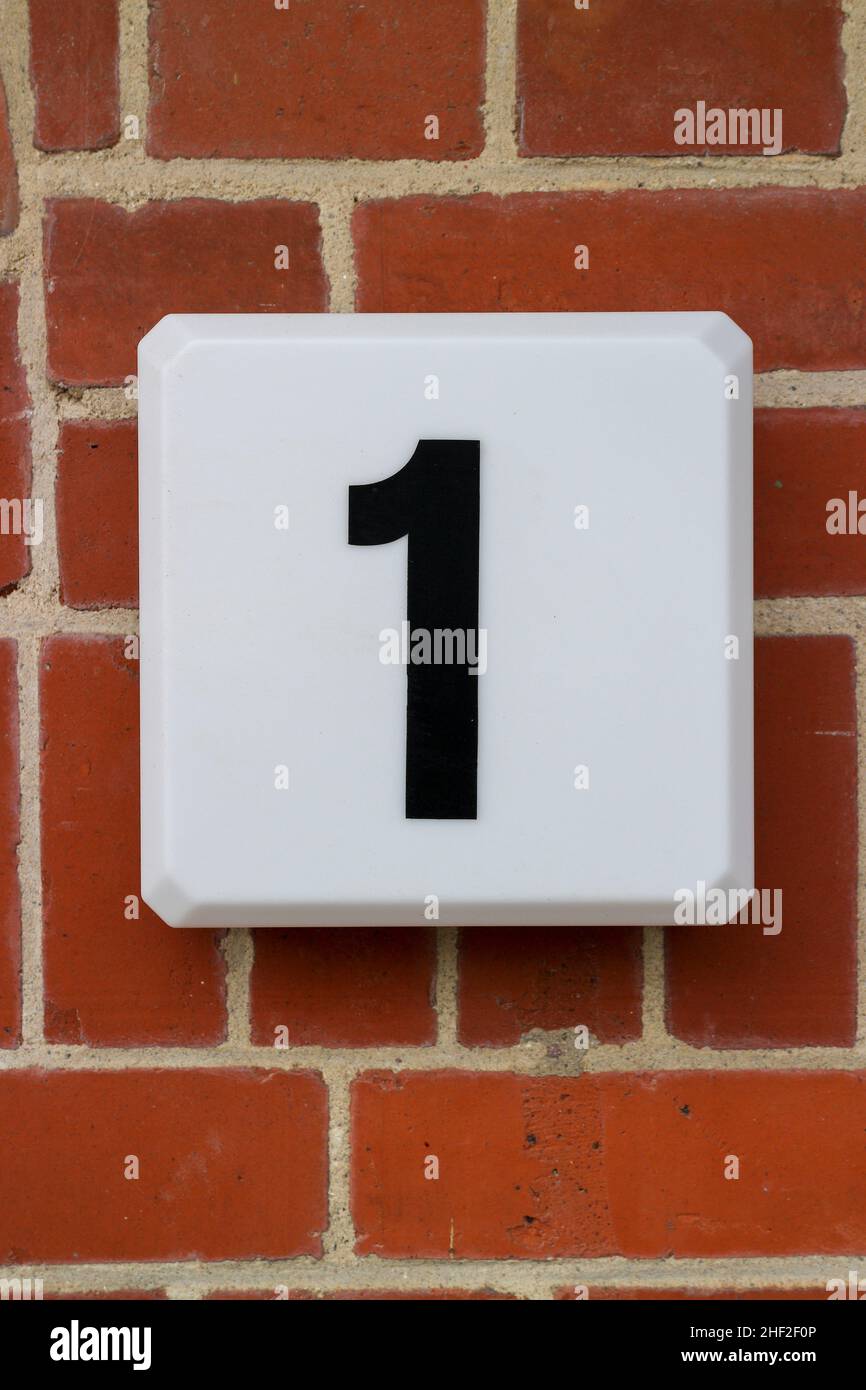 House number one on a brick wall Stock Photo - Alamy