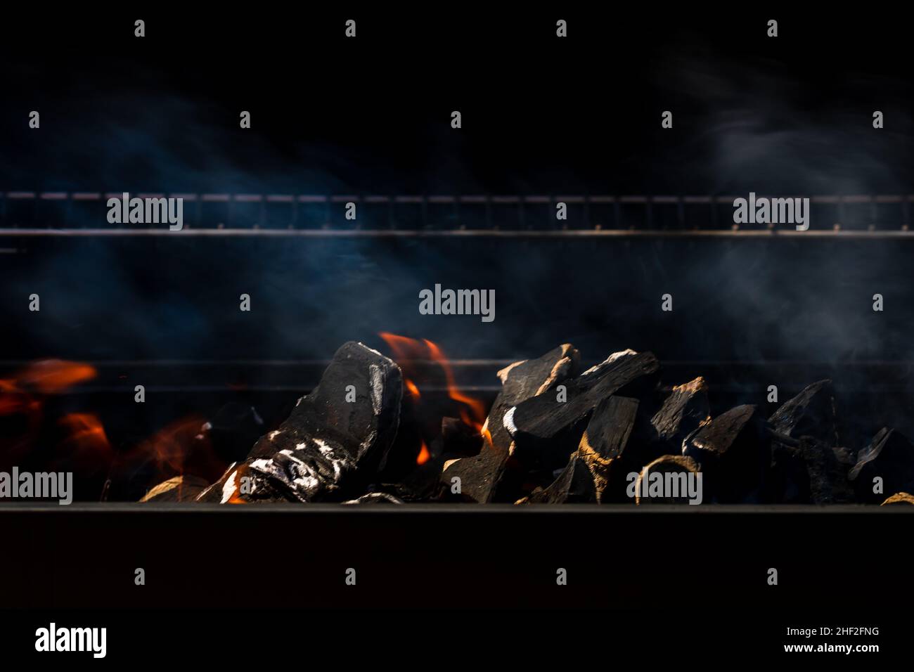 Barbecue grill pit with glowing and flaming hot open fire with red ...