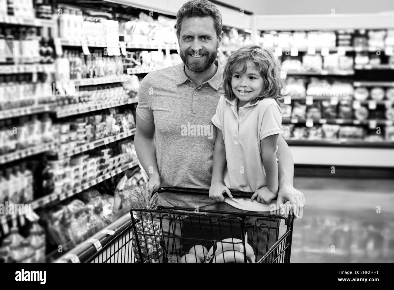 Father and son buy product in grocery store. Family in shop Stock Photo ...
