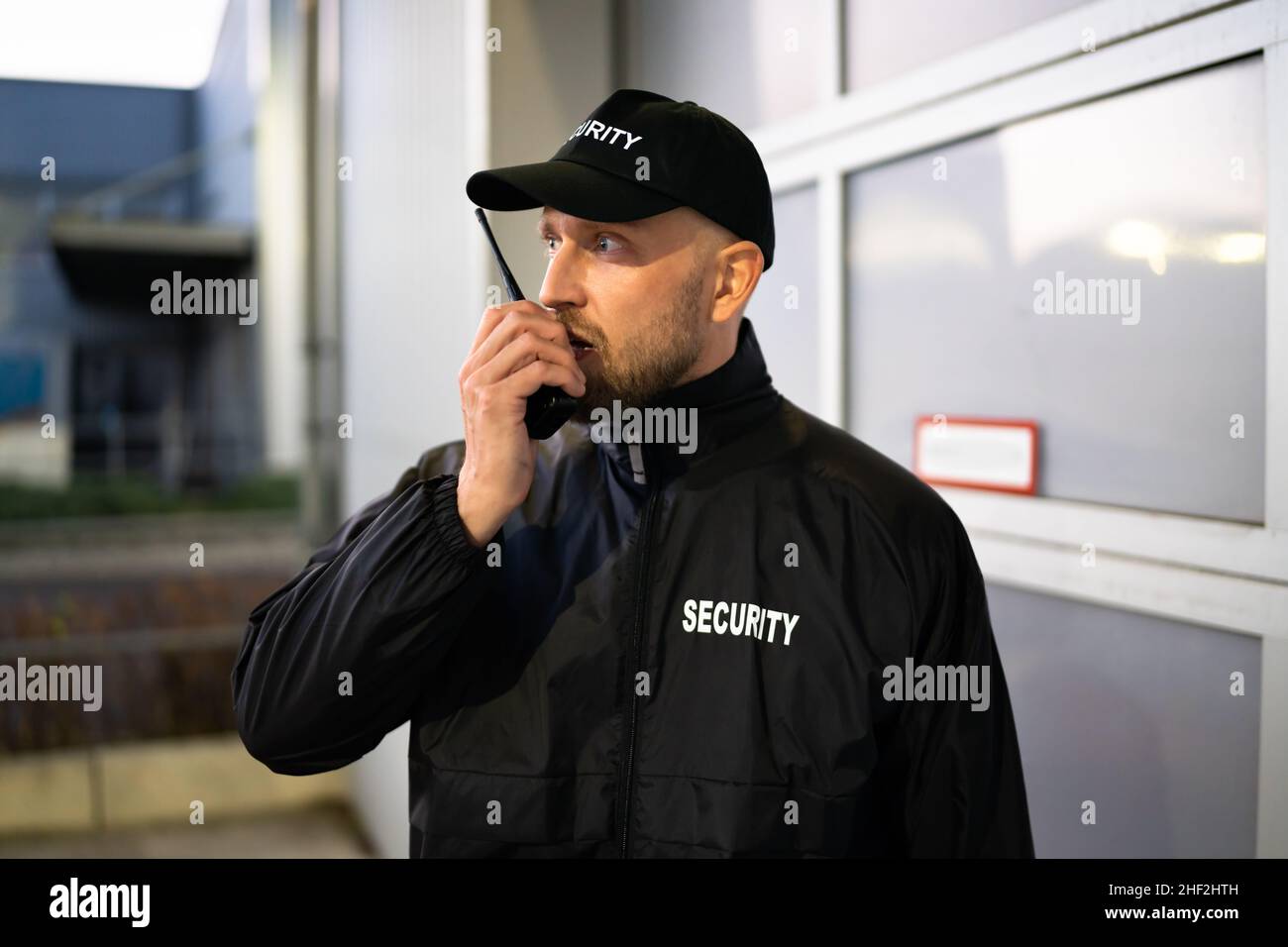 Policeman using walkie talkie hi-res stock photography and images - Alamy