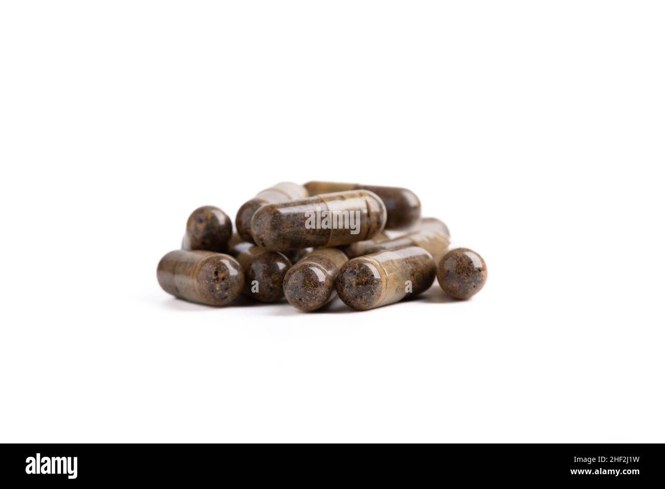 Capsules with nutritional supplements and vitamins on a white ...