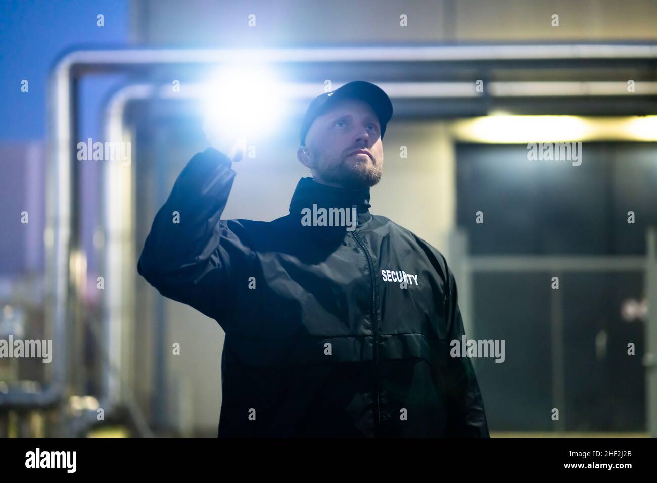 Security Guard Walking Building Perimeter With Flashlight At Night ...