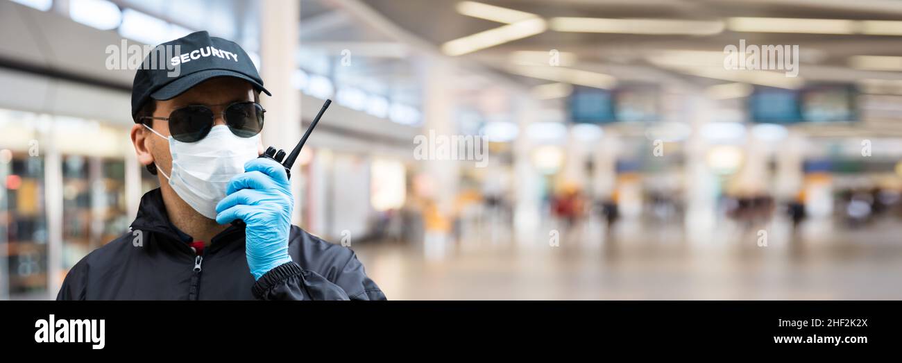 Security Guard Officer With Covid Mask In Airport Stock Photo - Alamy