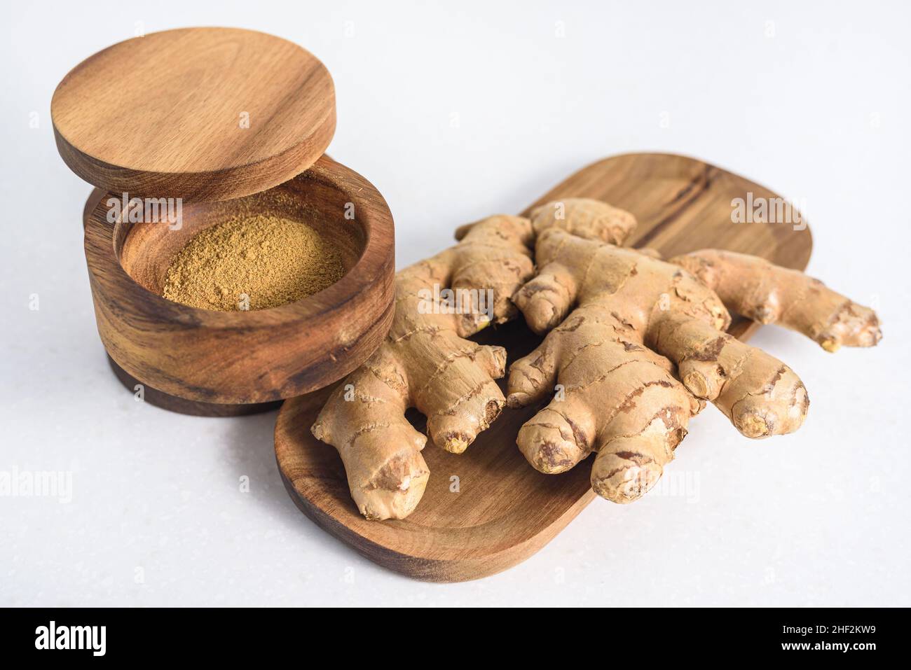 Ginger root and ginger powder in the bowl Stock Photo - Alamy