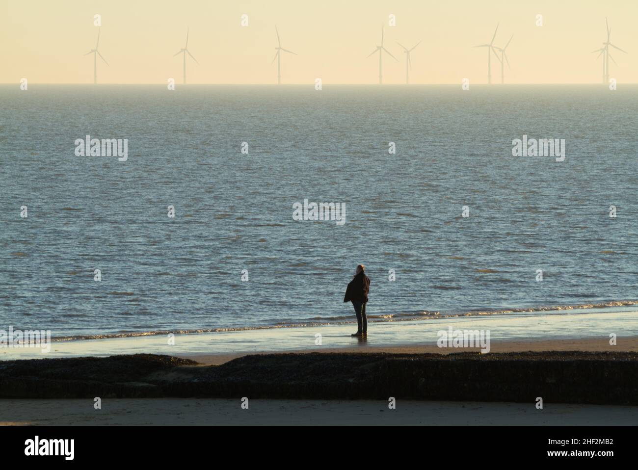 Man standing alone at beach hi-res stock photography and images - Alamy