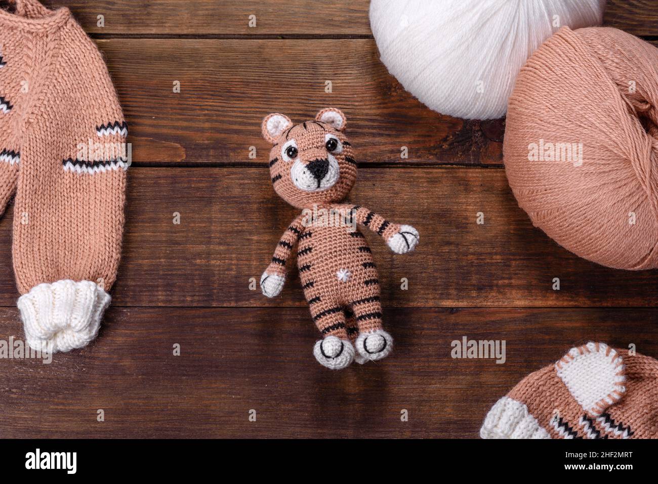 Beautiful knitted tiger from threads. Toy made with your own hands in ...
