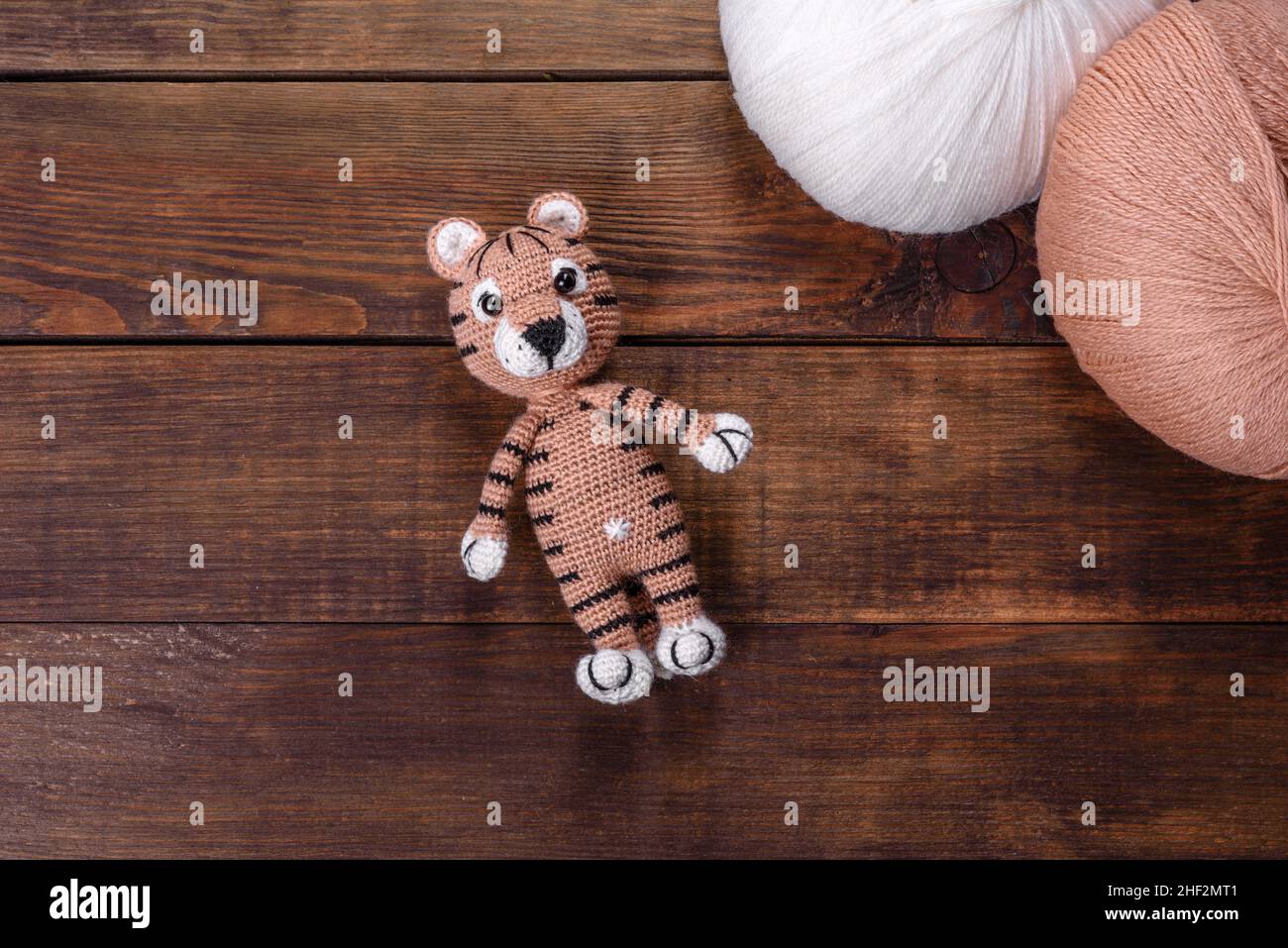 Beautiful knitted tiger from threads. Toy made with your own hands in ...