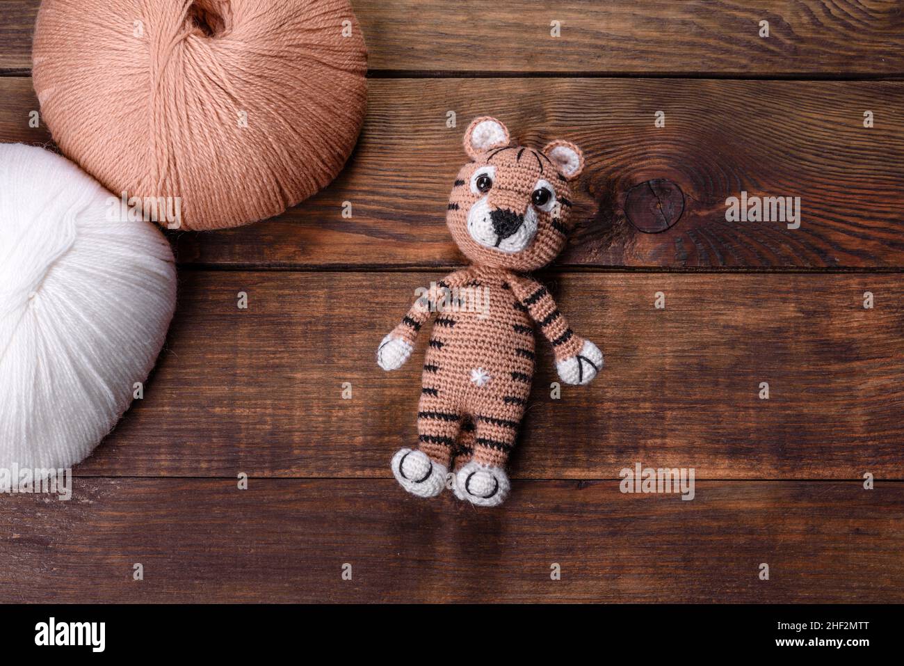 Beautiful knitted tiger from threads. Toy made with your own hands in ...