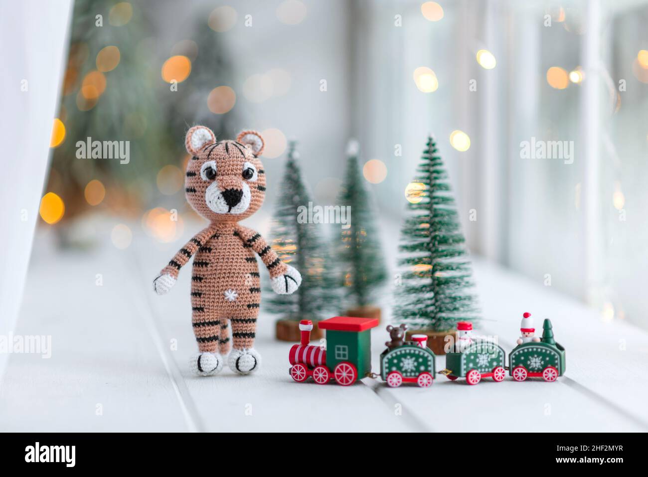 Beautiful knitted tiger from threads. Toy made with your own hands in ...