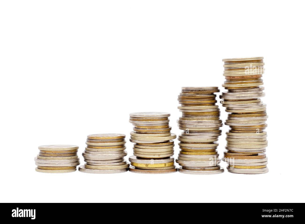 Five stacks of different coins isolate on white background. Money ...