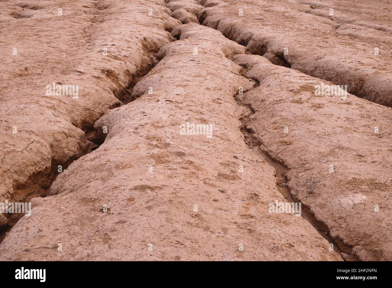 Natural landscape of cracks in red dry ground looks like martian ...