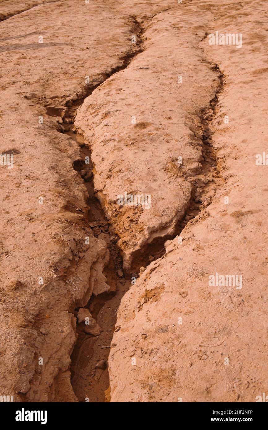 Natural landscape of cracks in red dry ground looks like martian ...