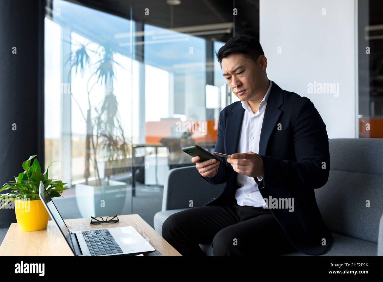 Unhappy Confused, angry asian man shopping online. customer cannot pay ...