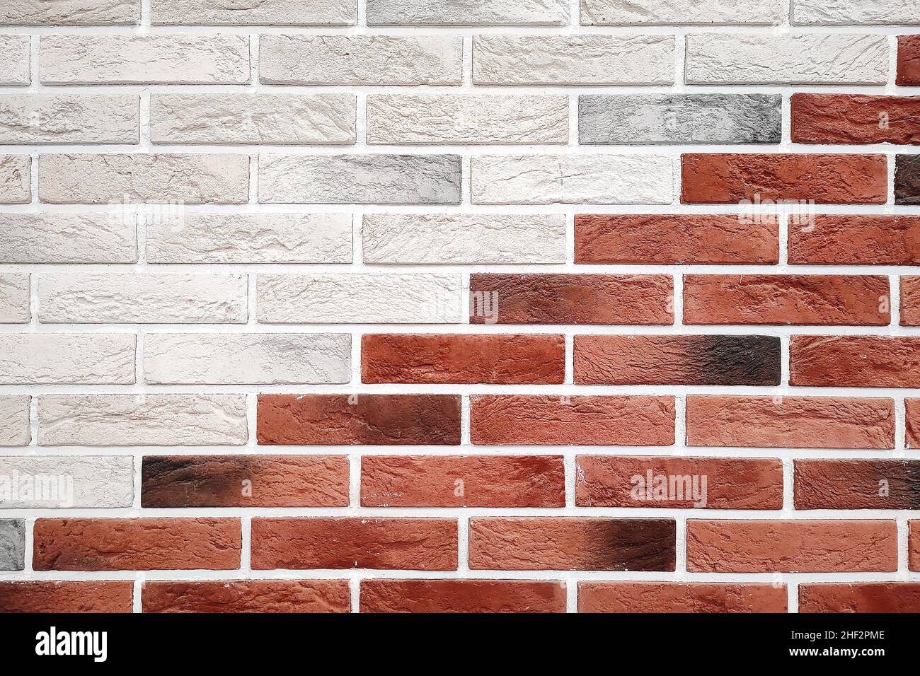 Decorative brickwork background of red and white bricks laid out ...