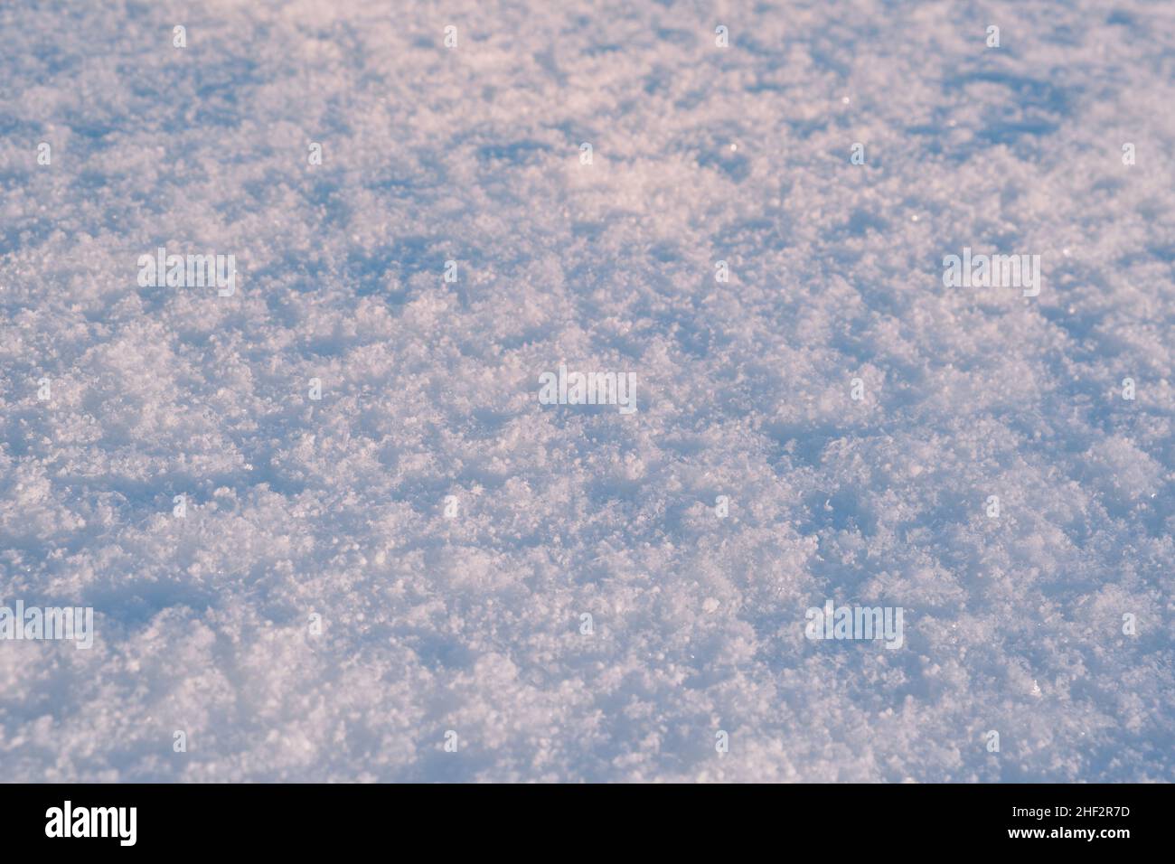 Snow surface texture in light blue tone. Winter season background ...