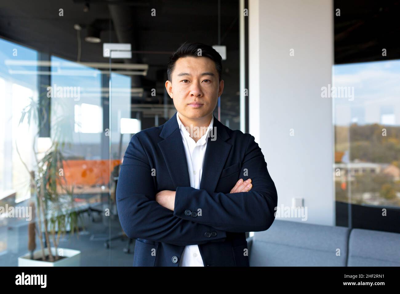 Portrait of successful business man boss Asian serious man looking at ...