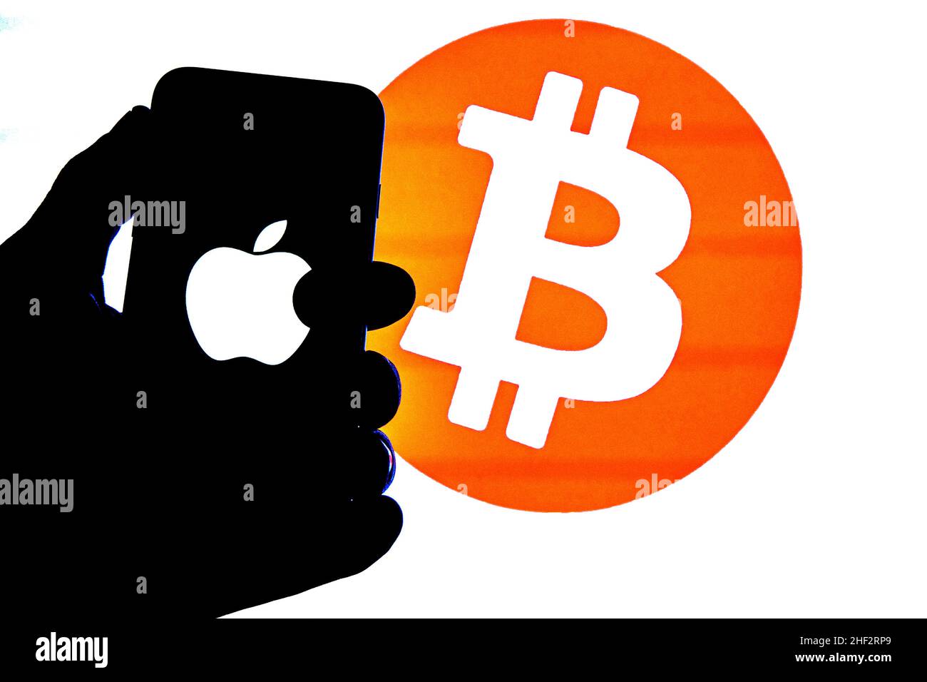 In this photo illustration a Apple logo seen displayed on a smartphone ...