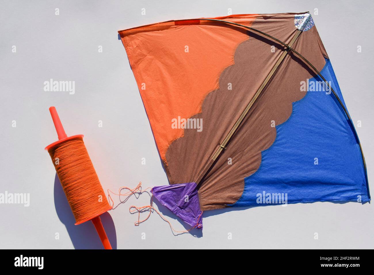 Big Kite and kite spool thread stringed to kite isolated on white ...