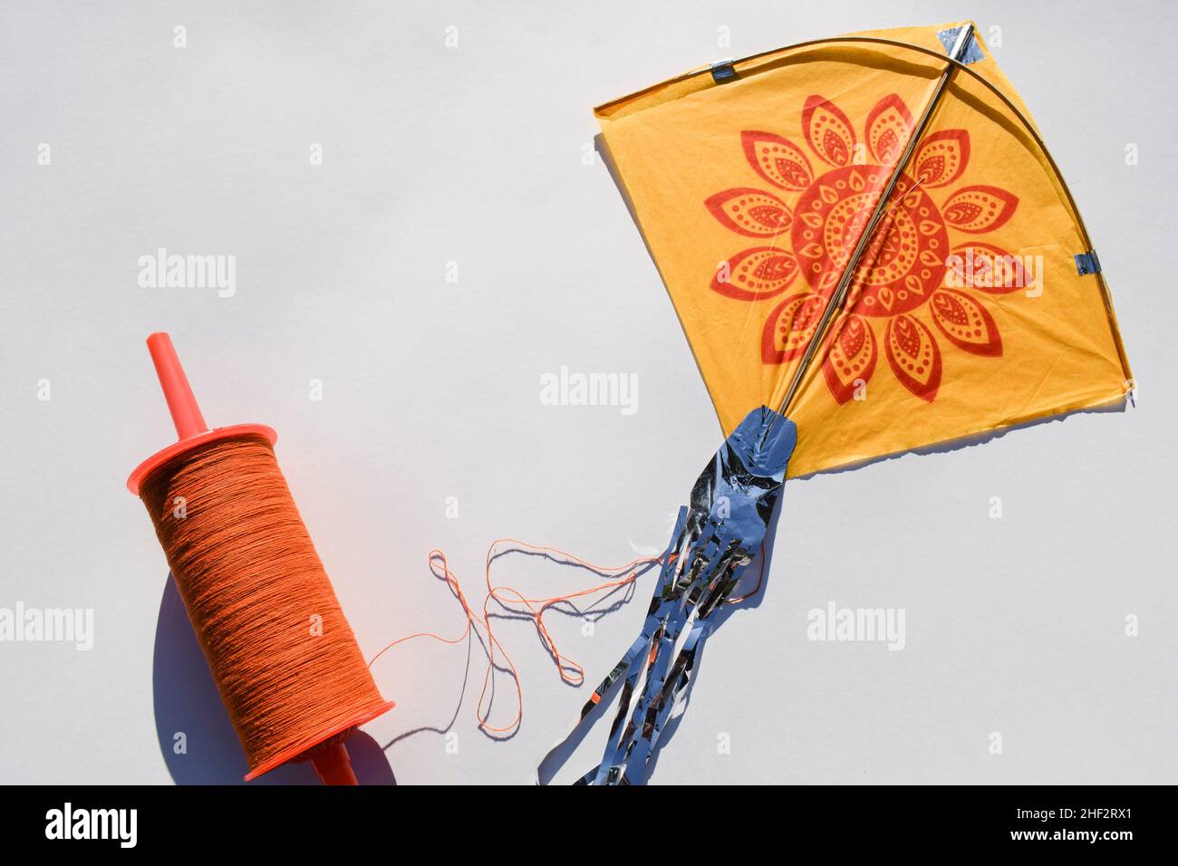 Big Kite and kite spool thread stringed to kite isolated on white ...