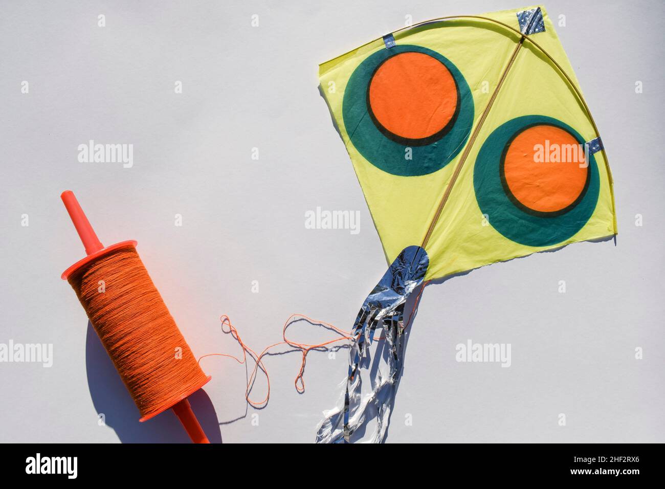 Big Kite and kite spool thread stringed to kite isolated on white ...
