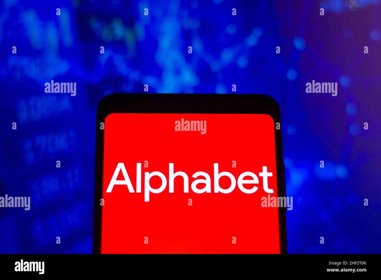 In this photo illustration, an Alphabet Inc. logo is seen displayed on ...