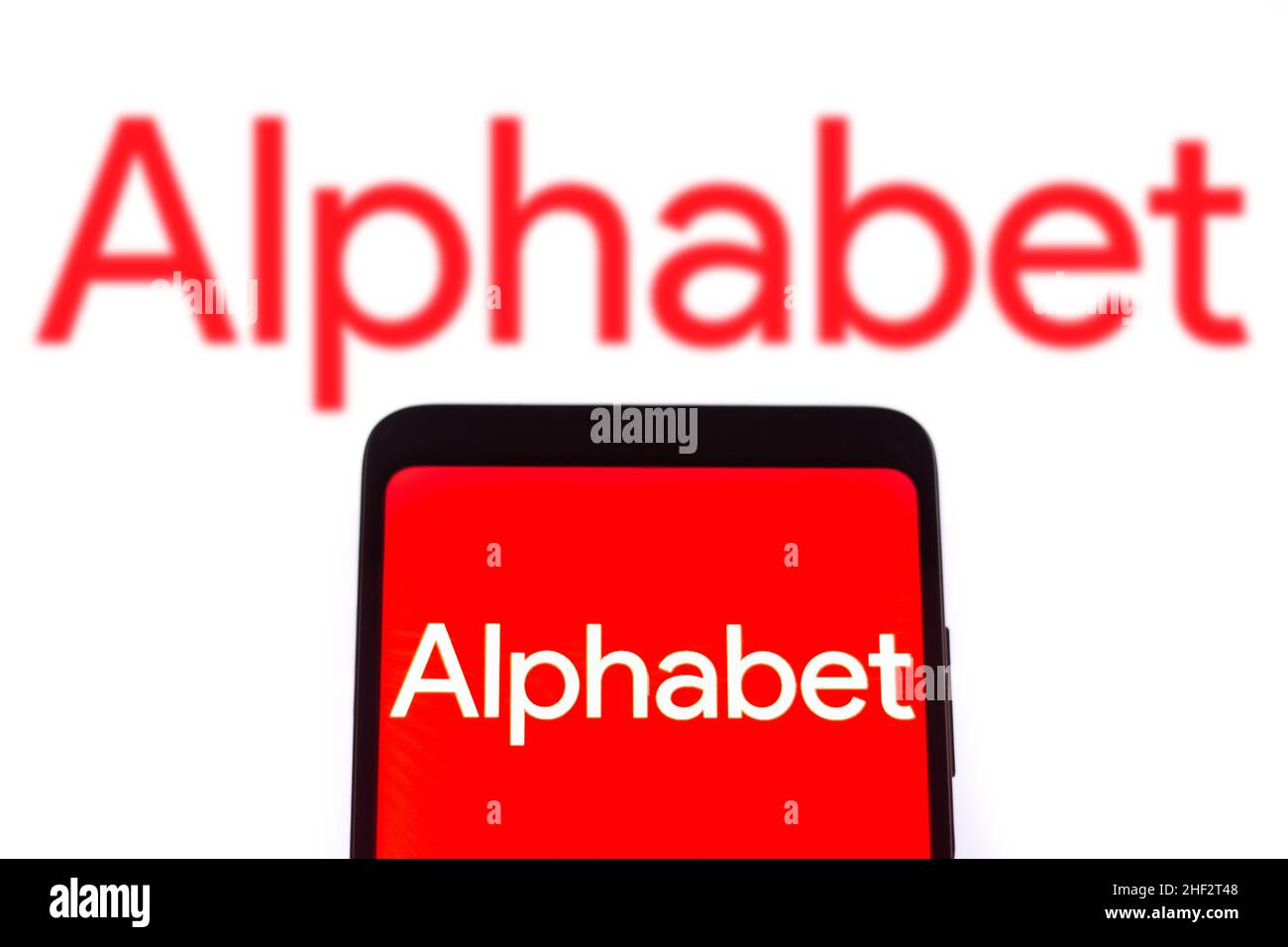 In this photo illustration, an Alphabet Inc. logo is seen displayed on ...