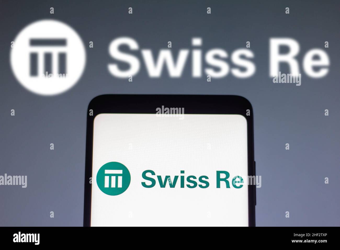 In this photo illustration, a Swiss Reinsurance Company logo is seen ...