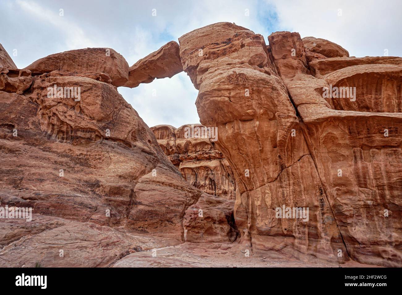 Arc or rock window formation in Wadi Rum desert stone cliffs around ...
