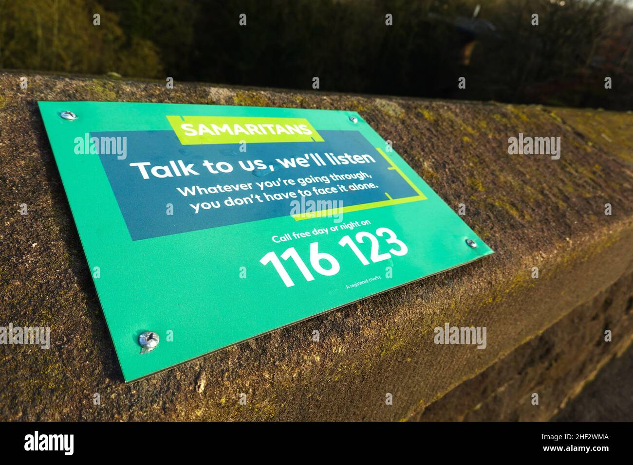 A Samaritans notice on a bridge in New Mills, Derbyshire Stock Photo ...