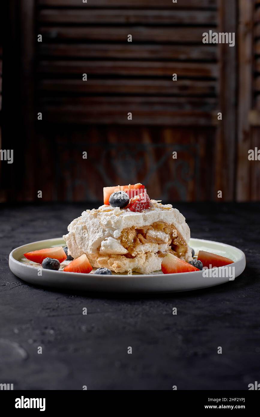 meringue roll with strawberries, blueberries, raspberries and ...