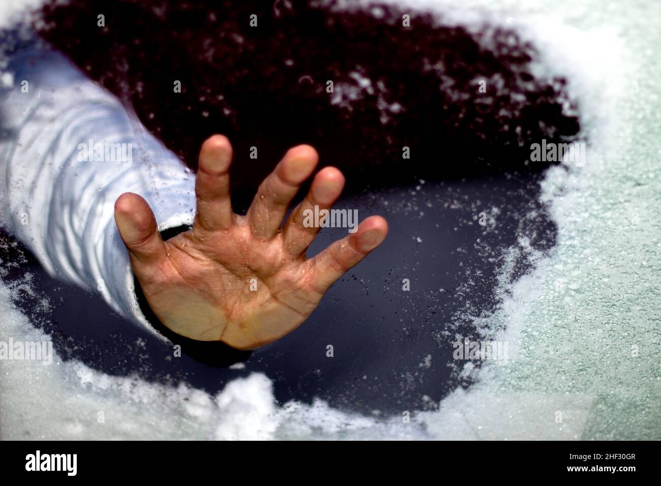 A male hand on the background of a windscreen at dark night. Stop and ...