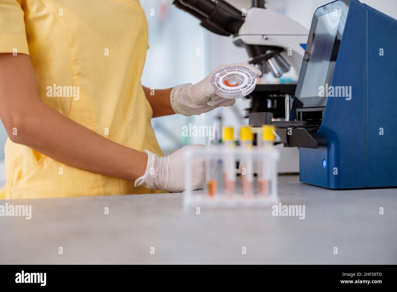 Science veterinarian working on microscope in lab Stock Photo - Alamy