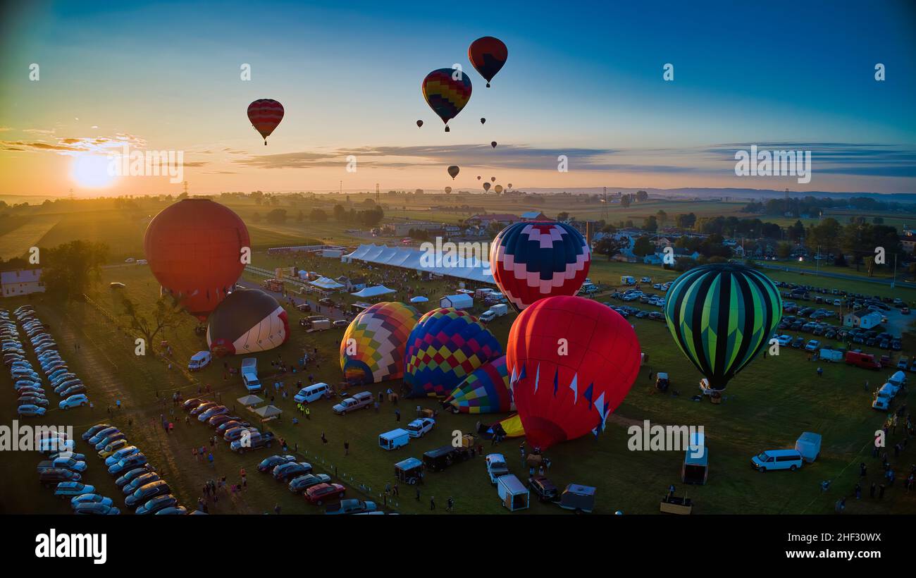 Aerial View of Many Hot Air Balloons Getting Ready to Take Off On An ...